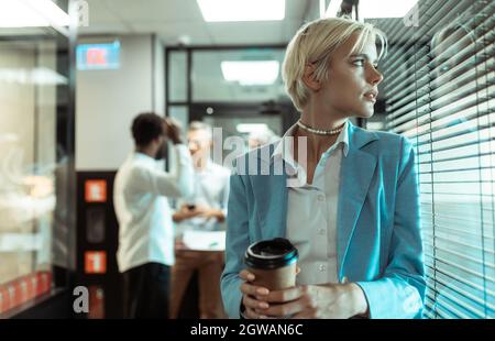 cinematic image of people working in a start up business. Multiethnic ...