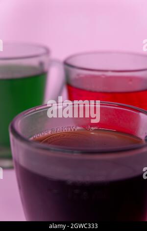 Glasses of water on table and colorful background Stock Photo - Alamy