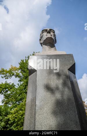 POZNAN, POLAND - Sep 12, 2021: A woman and two children standing by a large cage with parrots in ...