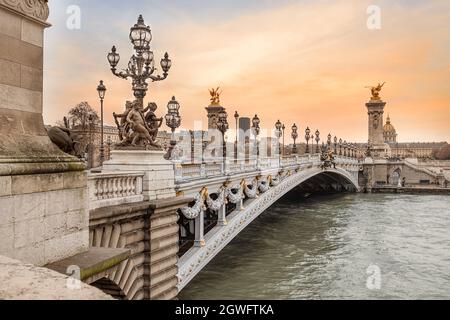 The ancient Pont Alexandre III deck arch bridge spanning the Seine in ...