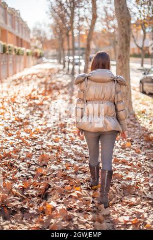 Woman with fallen leaves vertical Stock Photo - Alamy