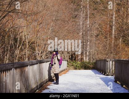 Traveler at winter forest of Nikko, Japan. Nikko is famous for its ...