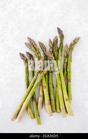 Fresh green asparagus shoots pattern, on a blue wooden background Stock ...
