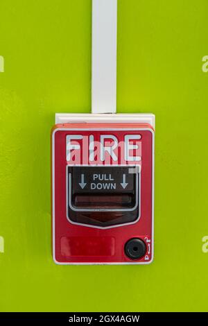 red fire alarm box on white background Stock Photo - Alamy