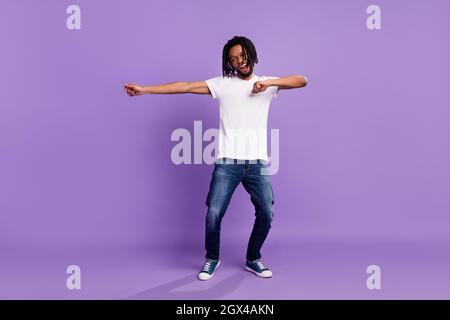 Full size photo of happy dark skin young man dance good mood wear tight ...