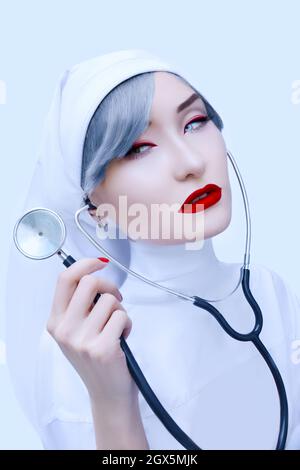 Gothic Nurse in white uniform Stock Photo - Alamy