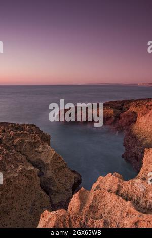 Vertical shot of the Praia da Foz beach during sunset Stock Photo - Alamy