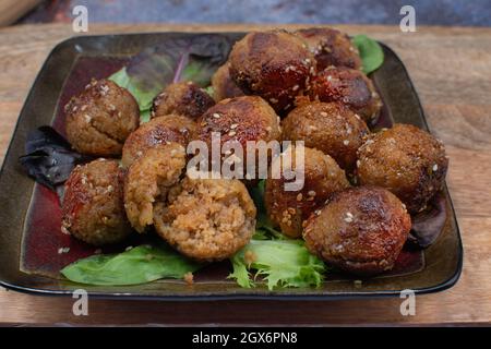 Seitan vegan meatballs tsukune style with tare sauce Stock Photo - Alamy