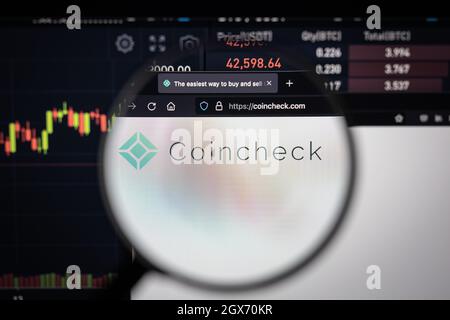 The Coincheck website seen through a magnifying glass Stock Photo - Alamy