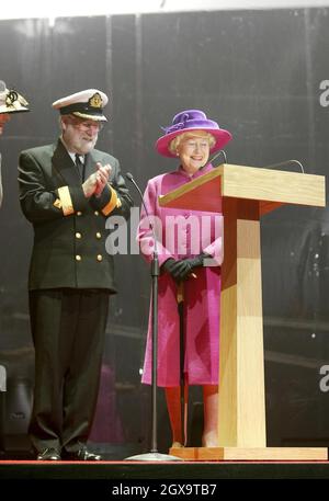 The Queen with Cmdr Ronald Warwick and Cunard President Pamela Conover ...