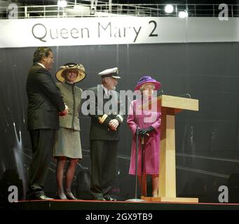 The Queen with Cmdr Ronald Warwick and Cunard President Pamela Conover ...