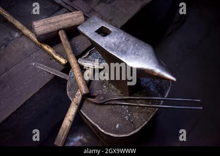 Working tool forge consisting of the anvil, hammer and tongs at ...