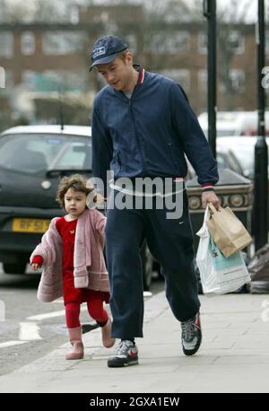 Damon Albarn holds hands with his daughter after a shopping trip in ...