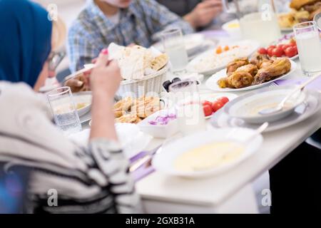 modern multiethnic muslim family enjoying eating iftar dinner together ...