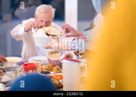 modern multiethnic muslim family enjoying eating iftar dinner together ...