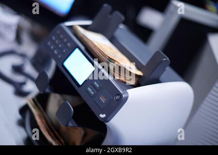Sorted banknotes placed on the table after it is counted on the ...
