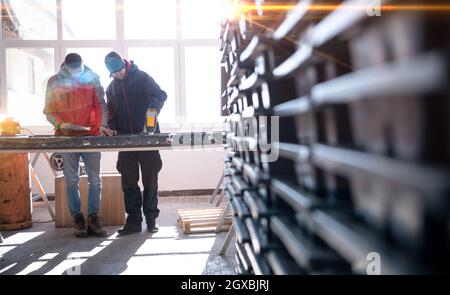 Geological gold core samples with team of mining workers measuring ...