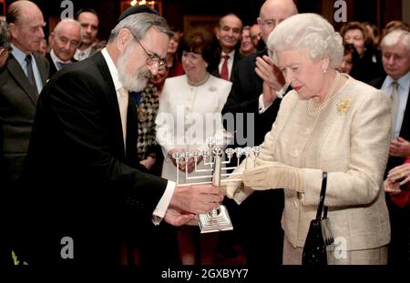 The Chief Rabbi Sir Jonathan Sacks (centre) after receiving his ...