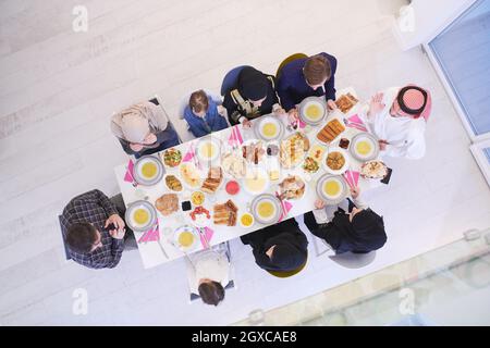 Eid Mubarak Muslim family having Iftar dinner Eating traditional food ...