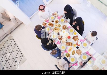 Eid Mubarak Muslim family having Iftar dinner Eating traditional food ...