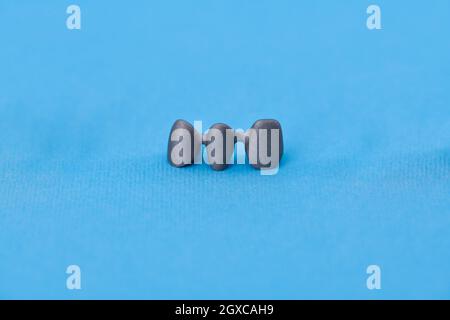 Dental silver metal tooth crowns isolated on blue background Stock ...