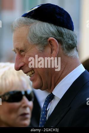 Prince Charles, Prince of Wales, wearing a Jewish yarmulka, attends the ...
