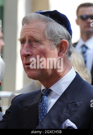 Prince Charles, Prince of Wales, wearing a Jewish yarmulka, smiles as ...