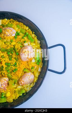 Paella Valenciana (Spanish traditional rice dish); rabbit, chicken ...