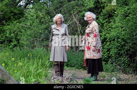 The Duchess of Cornwall, accompanied by aide Amanda Macmanus, waves as ...