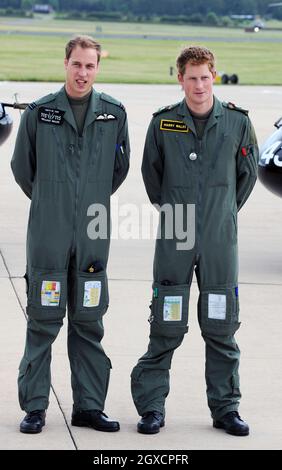 Prince William and Prince Harry pose during their military helicopter ...