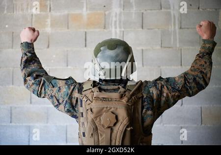 soldier celebrating victory raise arms winner concept Stock Photo - Alamy