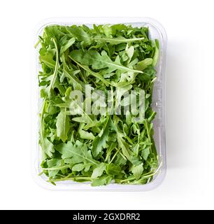 arugula in packaging on a white isolated background with clipping path ...