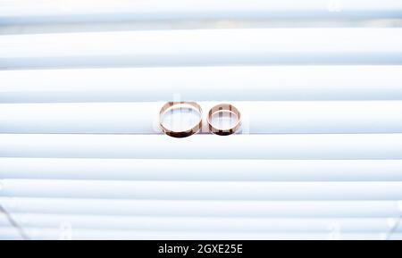 Two wedding rings in infinity sign. Love concept Stock Photo - Alamy