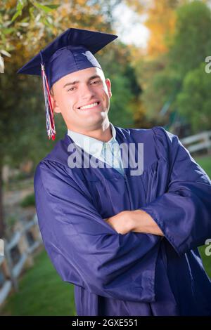 Happy Handsome Male Graduate in Cap and Gown Outside Stock Photo - Alamy