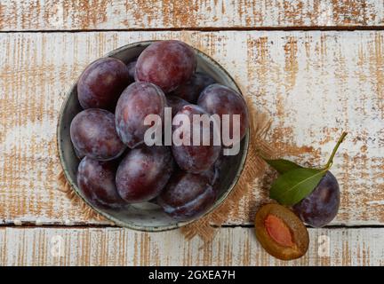 Fresh farm plums with leafs Stock Photo - Alamy