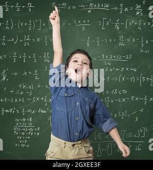 Genius child solves a mathematical calculation difficult Stock Photo ...