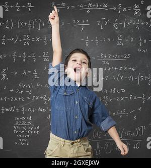 Genius child solves a mathematical calculation difficult Stock Photo ...