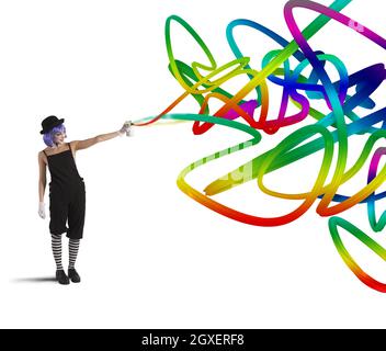 Woman clown with colored spray paints trails Stock Photo - Alamy