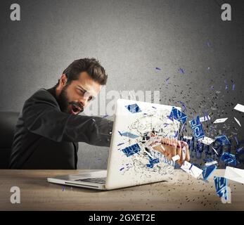 Angry businessman breaks the pc in office Stock Photo - Alamy