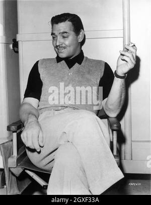 CLARK GABLE on set candid with Set Visitor ROBERT CANAVAN (his roommate ...