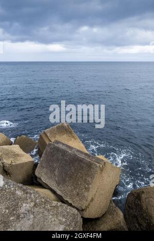 Detail of old cement dam on a beach in Spain Stock Photo - Alamy