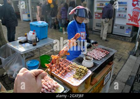 Grilled octopus for sale on the streets of Enoshima, Japan Stock Photo ...