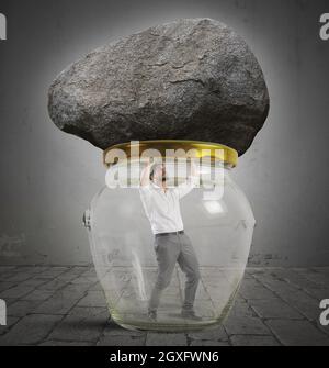Man trapped in a jar with rock Stock Photo - Alamy