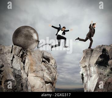 Man jumps between two mountains before the man with a heavy ball ...
