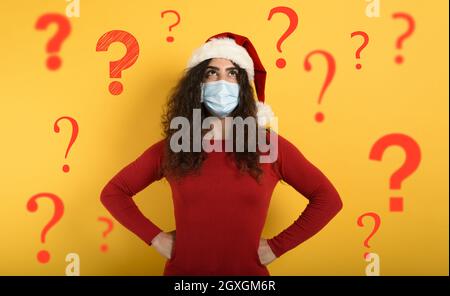 Woman with face mask is confused about something Stock Photo - Alamy
