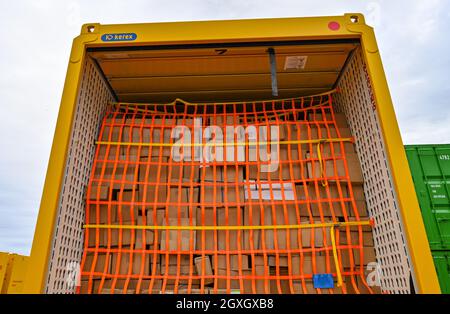 04 October 2021, Brandenburg, Großbeeren: A Deutsche Post DHL container ...