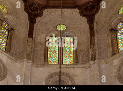 Skylight with perforated stucco arched windows decorated with colorful ...