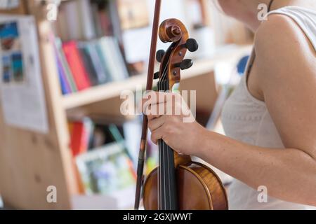 Pretty young girl practices on her violin, acoustic music Stock Photo ...