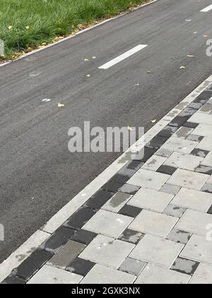 A vertical shot of bicycle direction signs on a metal surface Stock ...