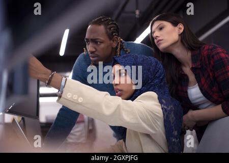 young multiethnics business team of software developers working ...